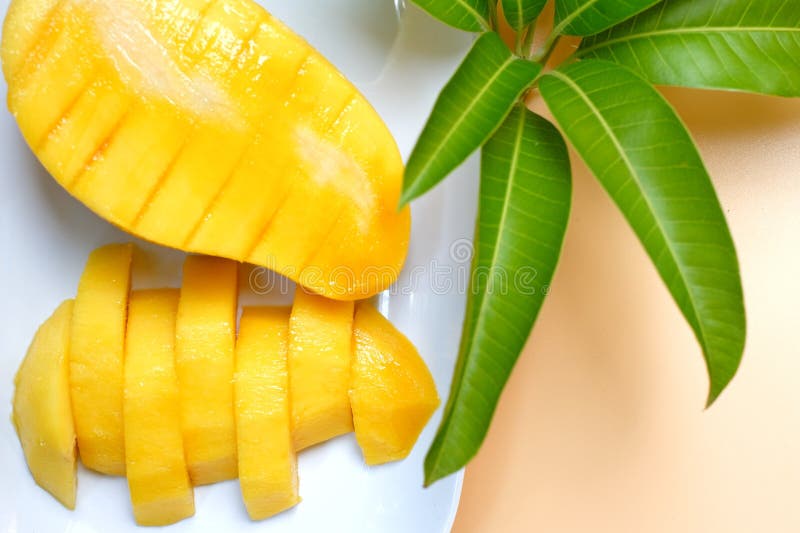 Yellow Ripe Mangoes, Cut into Pieces in a White Dish. Stock Photo ...
