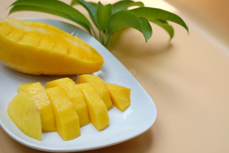 Yellow Ripe Mangoes, Cut into Pieces in a White Dish. Stock Photo ...