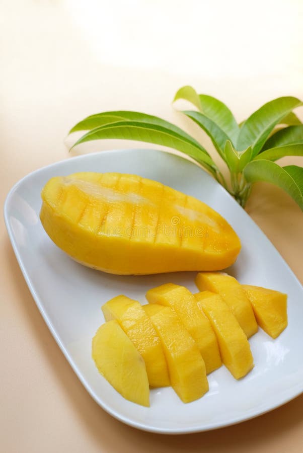 Yellow Ripe Mangoes, Cut into Pieces in a White Dish. Stock Image ...