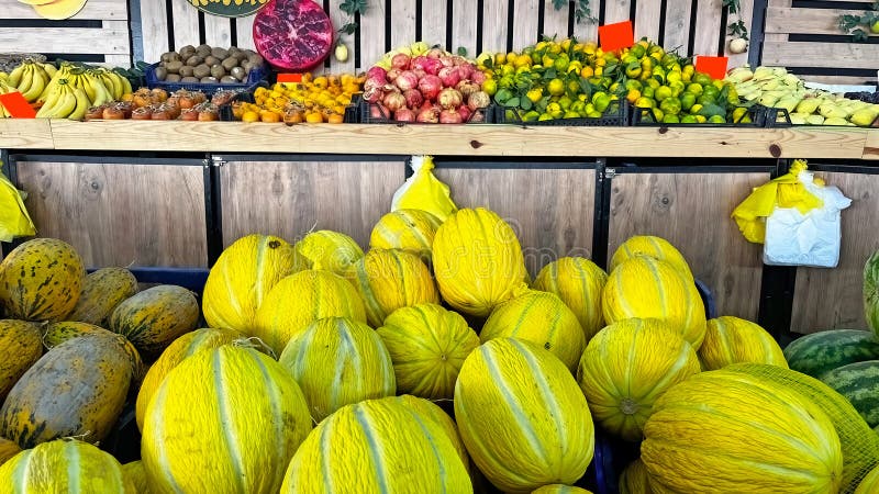 Yellow Ripe Melons and Various Fruits in the Fruit Section at the ...