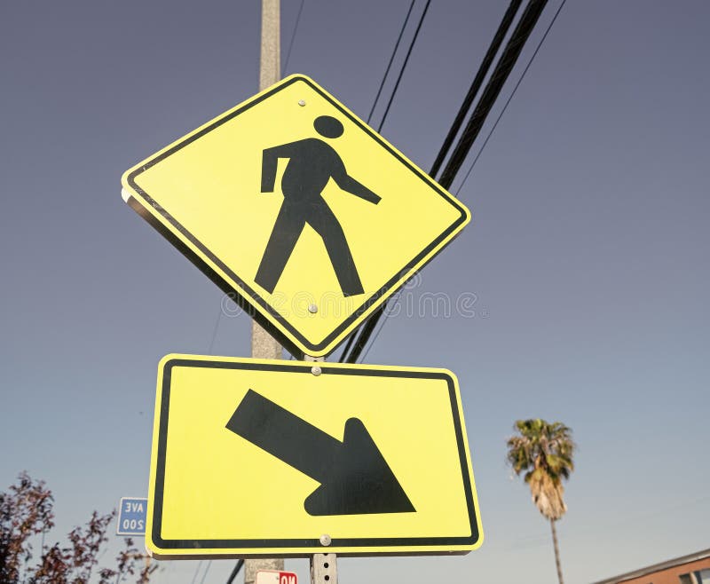 Yellow Road Sign for Pedestrian Directing this Way Stock Photo - Image ...