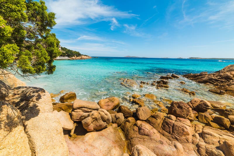 Yellow Rocks in Capriccioli Beach Stock Image - Image of sand, blue ...