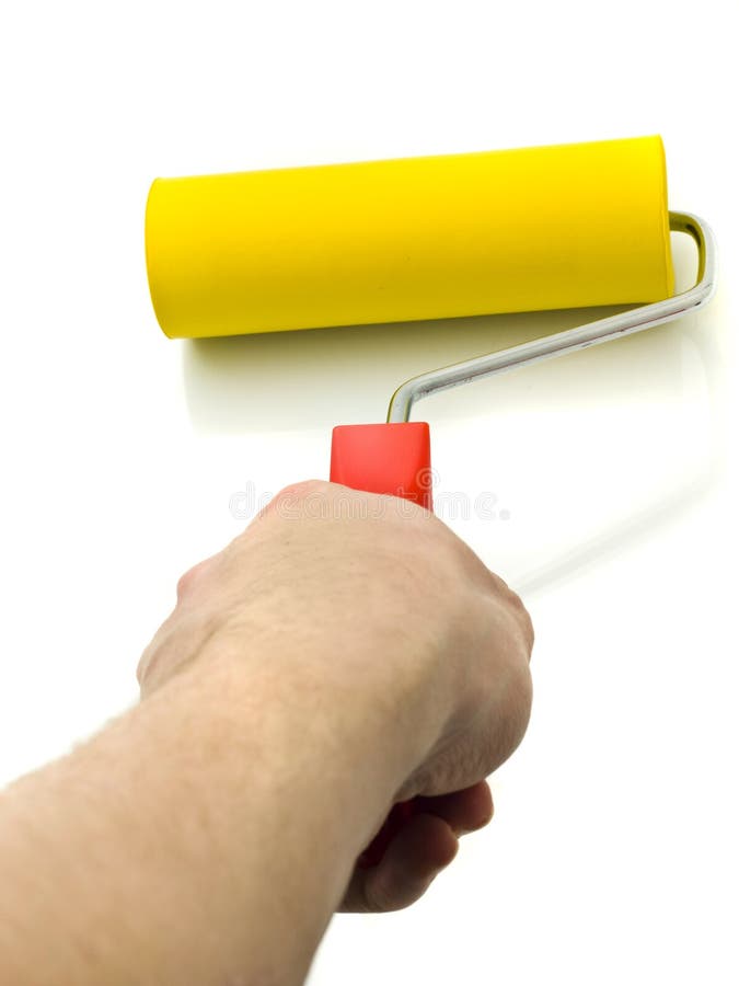 Yellow Roller for Renovation in Hand Stock Photo - Image of decorating ...