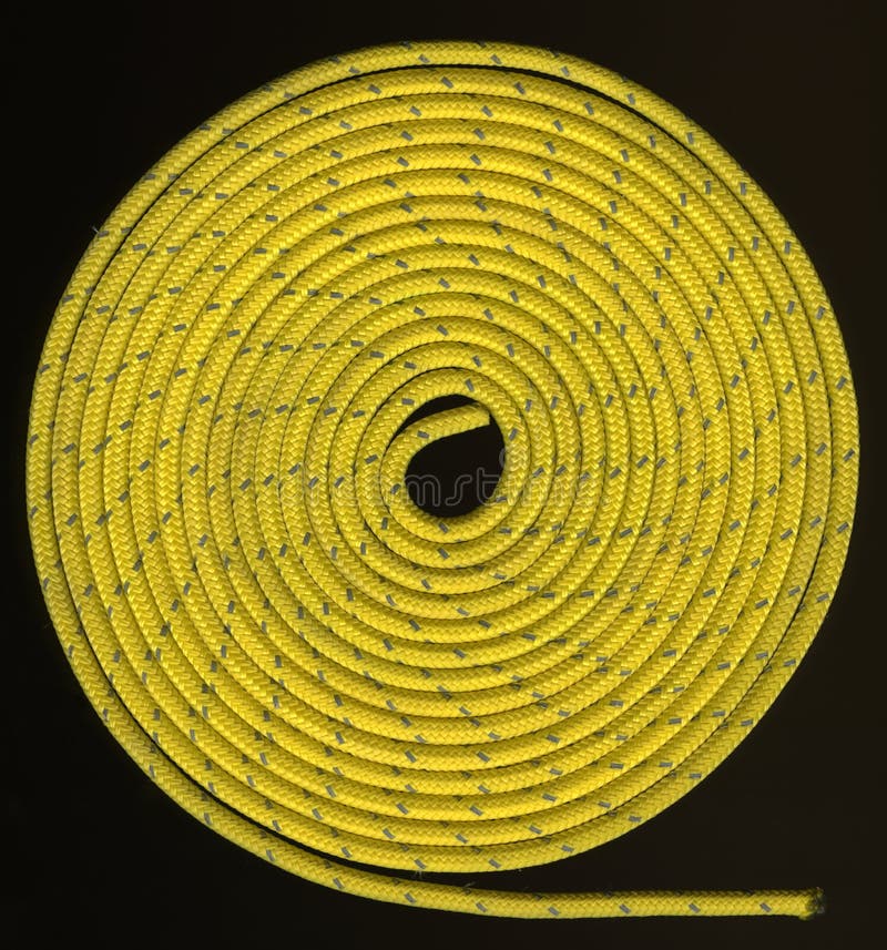 Yellow rope in tight coils stock photo. Image of loose - 5429974