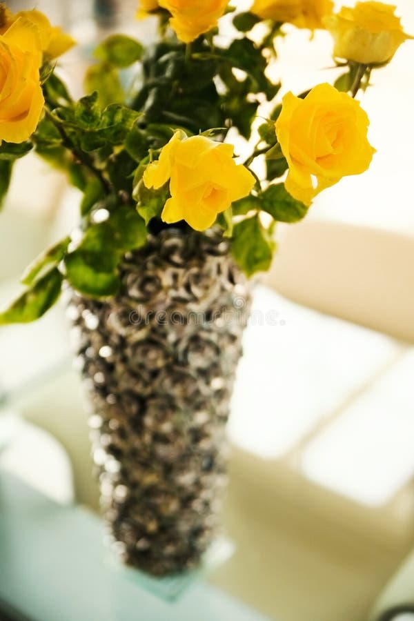 Yellow roses in a vase stock image. Image of lovely, container - 64142337
