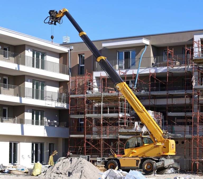 Yellow Rotating Telehandler at Work in the Construction Site Stock ...