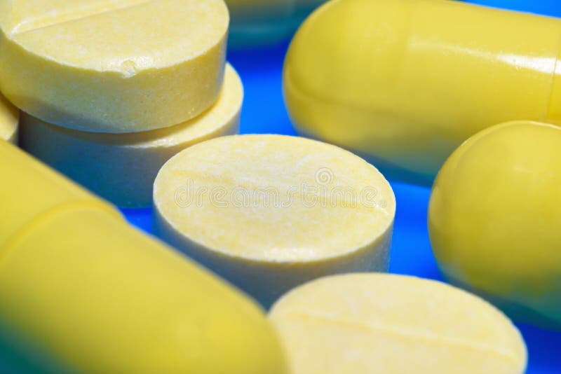 Yellow Round Pill and Capsules Close-up. Macro Stock Photo - Image of ...