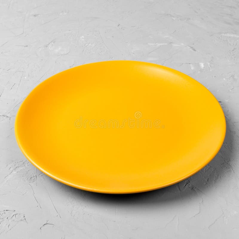 Yellow Round Plate on Grey Cement Table Background. Top View, Template ...