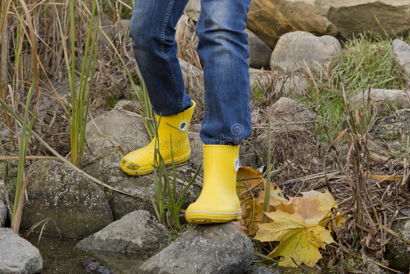 Yellow rubber boots stock photo. Image of puddle, boots - 65705672