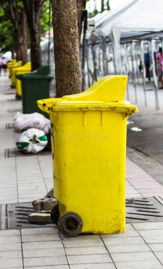 Yellow Rubbish Bins stock image. Image of building, refuse - 22307711