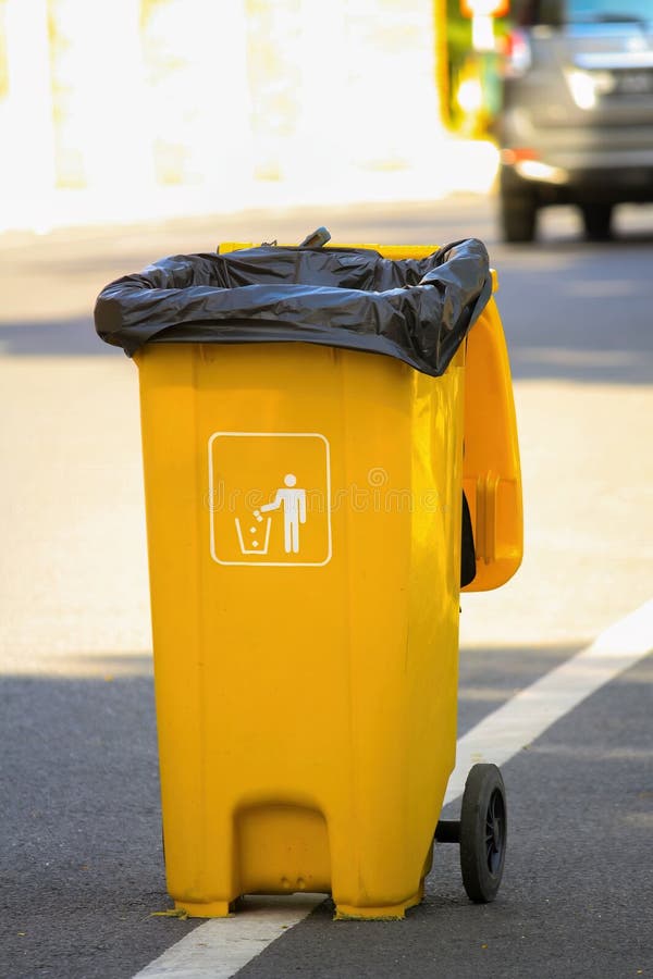 Yellow Rubbish Bin, on the Streets Stock Image - Image of streets ...