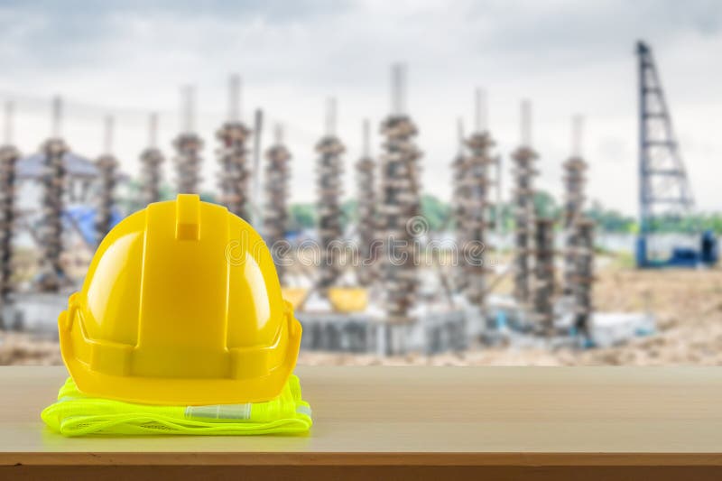 Safety Construction Helmet on Wood Table with Construction Site ...