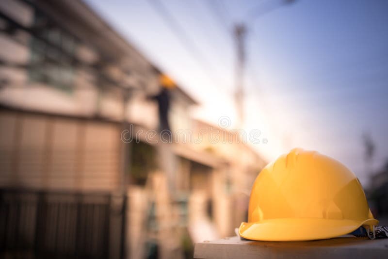 The Yellow Safety Helmet at Construction Site with Sunlight Stock Photo ...