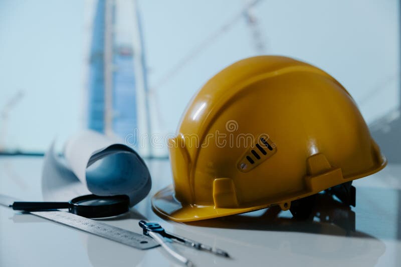 Yellow Safety Helmet Hat and Projects of Construction Site Building on ...