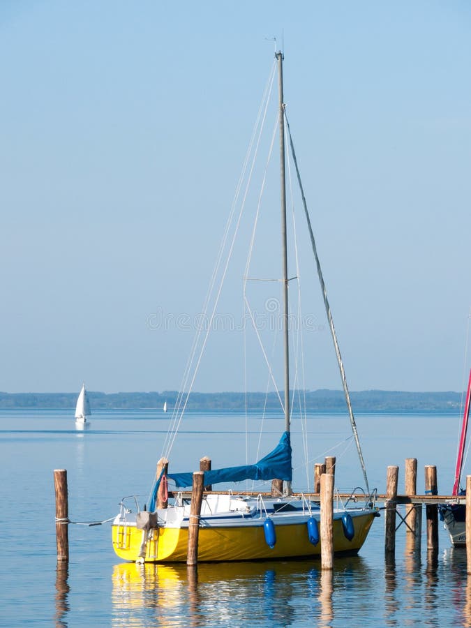 Yellow Sailboat on an Alpine Lake Stock Image - Image of water, alps ...