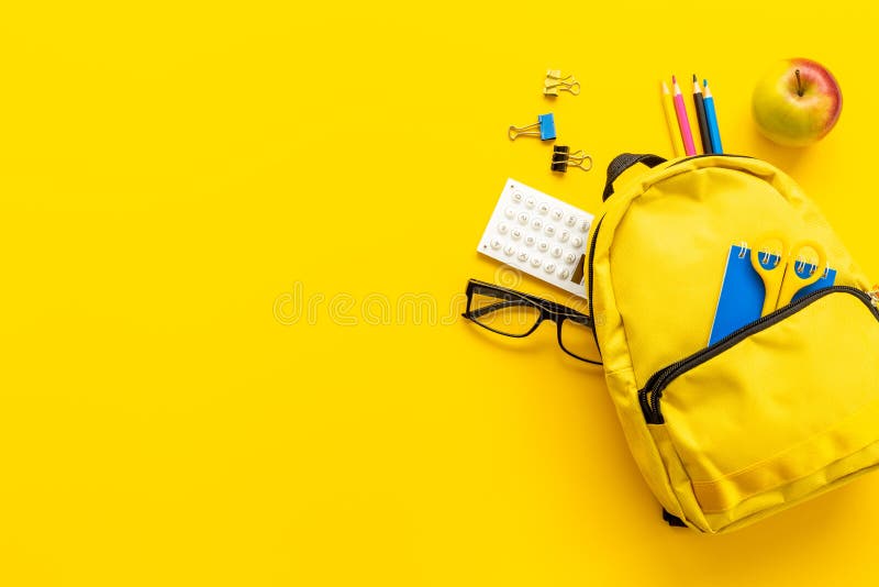 Yellow School Backpack with Colorful School Stationery Stock Photo ...