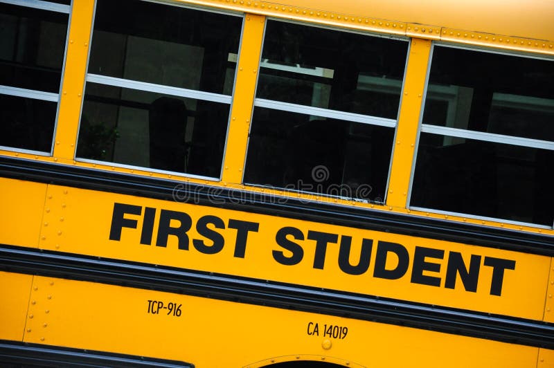Yellow School Bus with First Student Logo, Showcasing Iconic Design ...