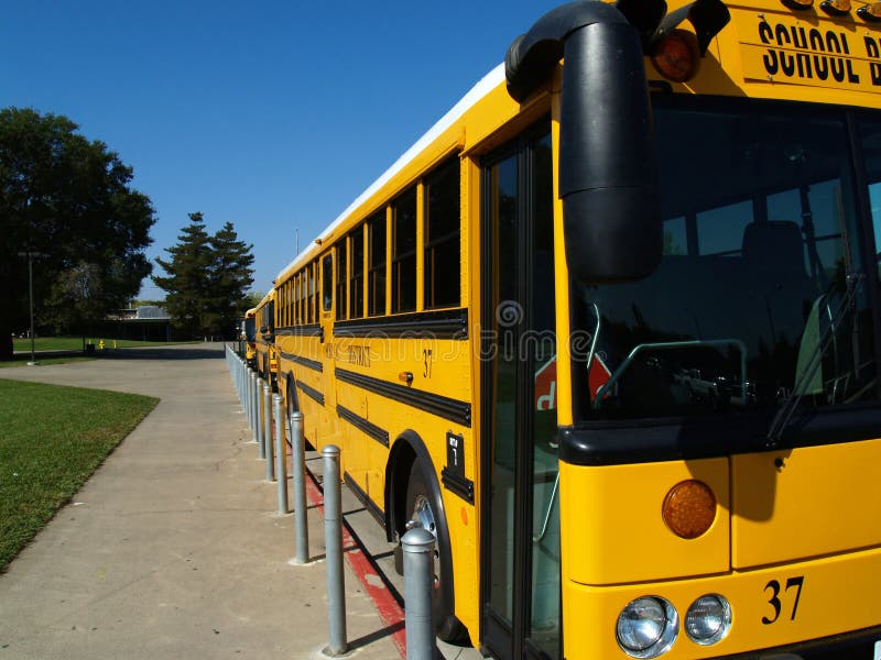 Yellow School Bus Parked Along Sidewalk Curb Stock Photo - Image of ...