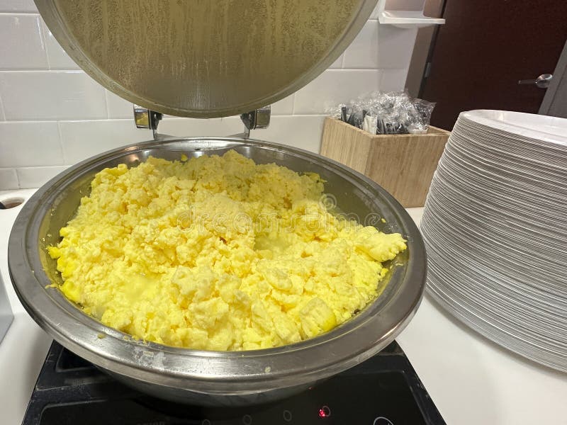 Yellow Scrambled Eggs Heating in a Metal Container at a Hotel Breakfast ...