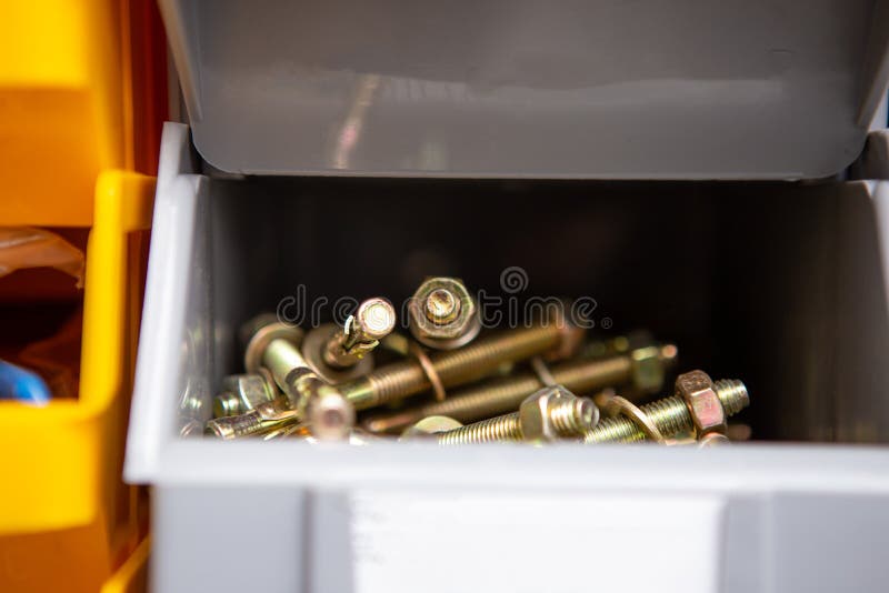 Yellow Screws in a Plastic Box in a Hardware Store Stock Photo - Image ...