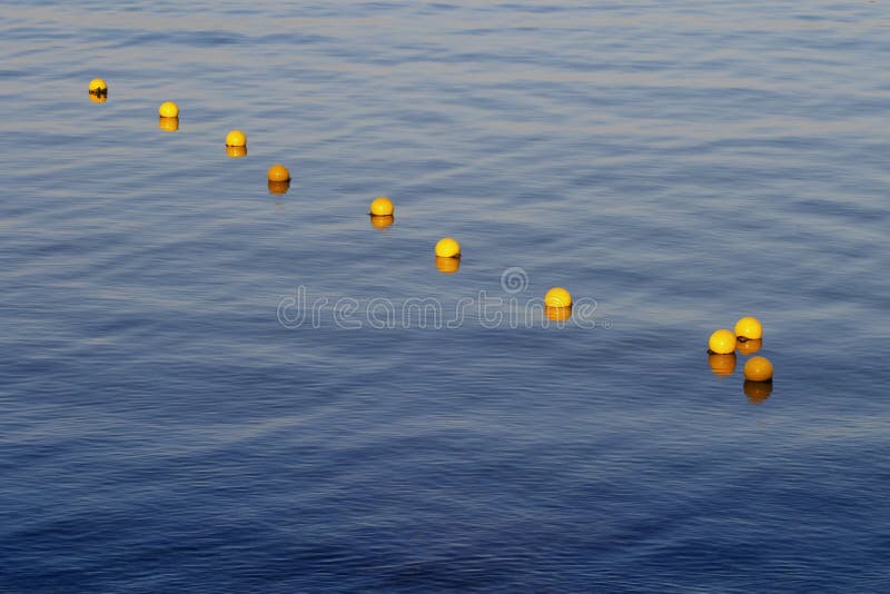 Yellow sea buoys stock image. Image of blue, yellow, water - 10879803