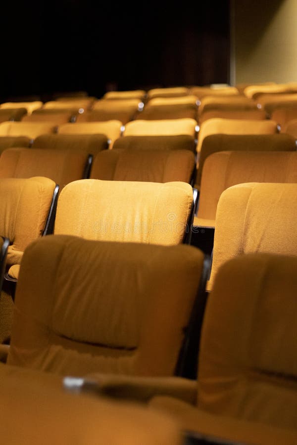 Yellow seat of a theater stock image. Image of intermittend - 180285319