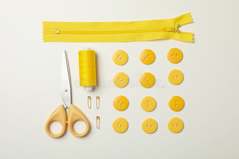 Yellow Sewing Supplies on White Background, Top View Stock Photo ...