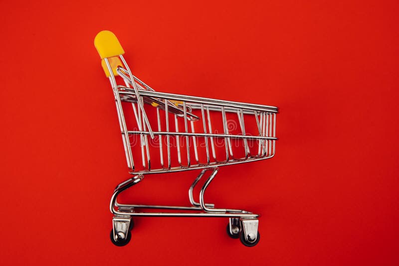 Yellow Shopping Cart Isolated on Red Stock Image - Image of chrome ...