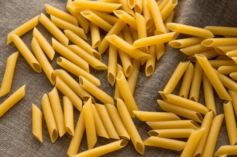 Short-cut Raw Macaroni on Blue Background Food and Drink Concept Stock ...