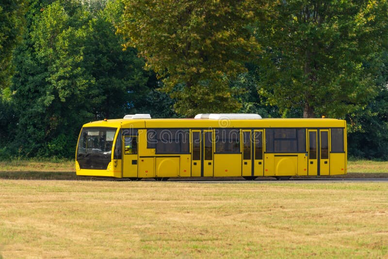 Yellow Shuttle Bus To Transport People at the Airport To the Flight ...