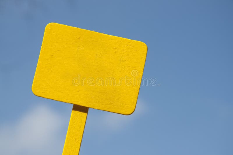 Yellow Sign on Bright Blue Cloudy Sky Stock Photo - Image of yellow ...