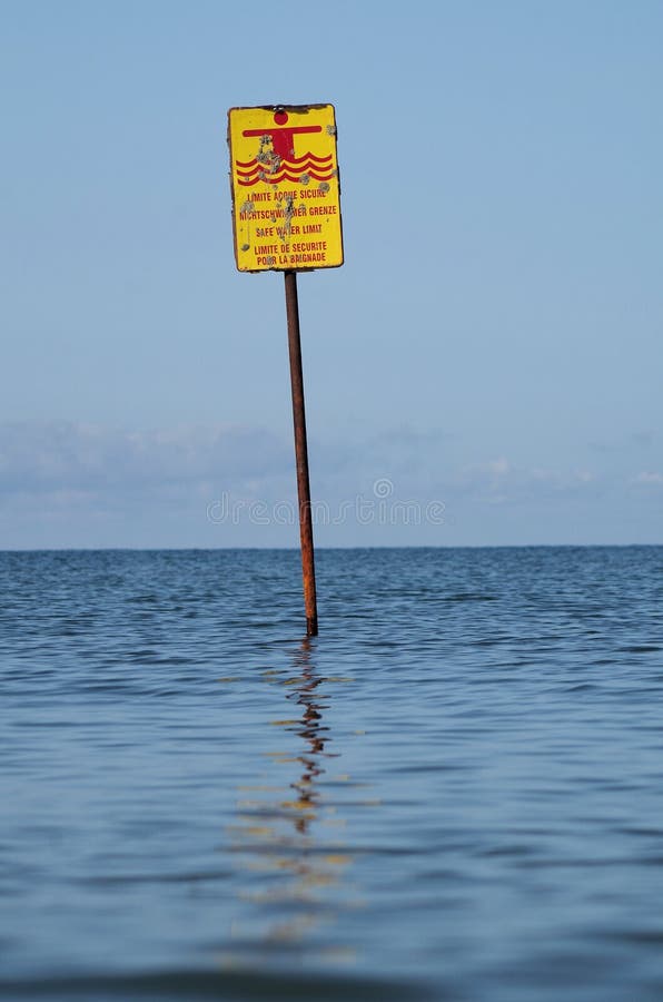 A Yellow Sign into Ocean Water Stock Image - Image of landscape, float ...
