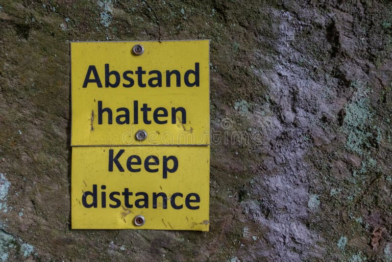Yellow Sign on a Rock with Keep Distance while Hiking Stock Image ...