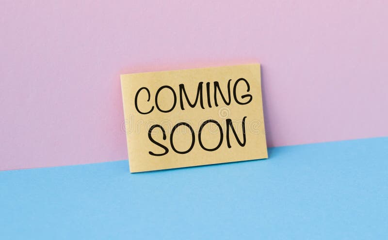 A Yellow Sign that Says Coming Soon is on a Blue Background Stock Image ...