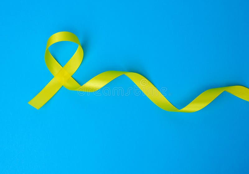Yellow Silk Ribbon Loop on a Blue Background Stock Image - Image of ...