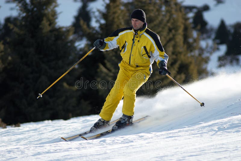 Yellow skier on ski slope stock image. Image of mountains - 3340689