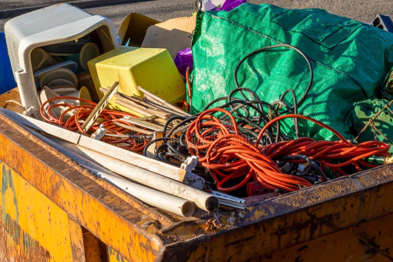 A Yellow Skip Full of Rubbish Stock Image - Image of cardboard ...