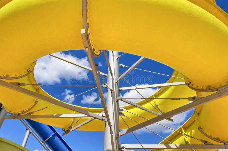 Yellow Slide in a Water Park Against the Sky Stock Photo - Image of ...