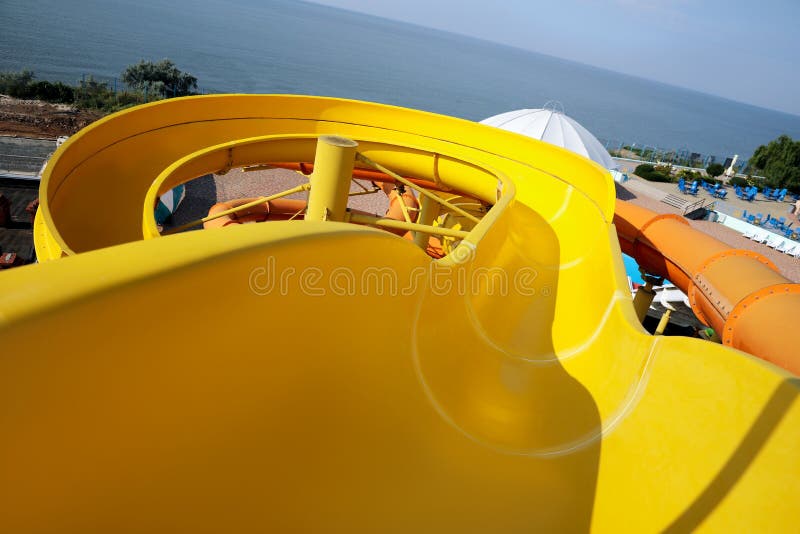 Yellow Slide in Water Park on Sunny Day Stock Image - Image of active ...