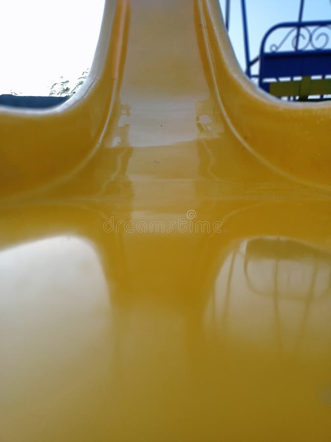 Yellow Sliding Park Playground Stock Photo - Image of park, sliding ...