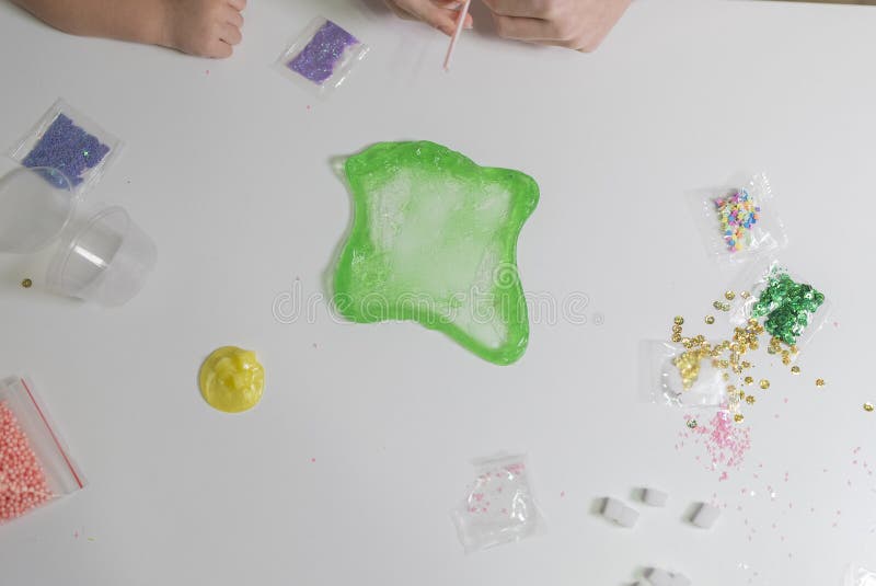 Yellow Slime at Table Fun at Home Stock Image - Image of person, sticky ...