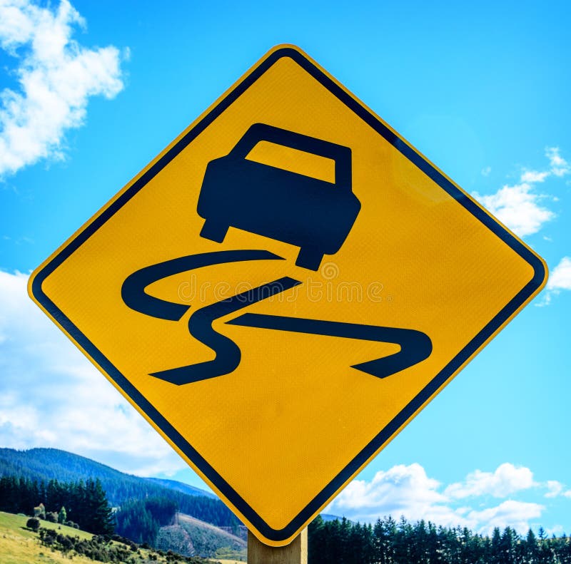 Yellow slippery road sign stock photo. Image of clip - 48287152