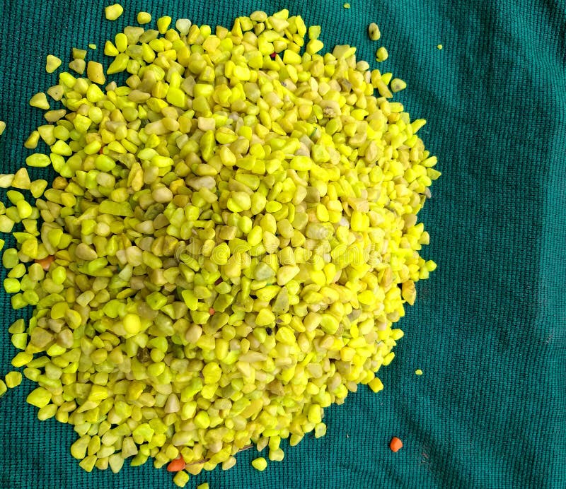 Yellow Small Stone on the Green Mat Stock Image - Image of stone, green ...