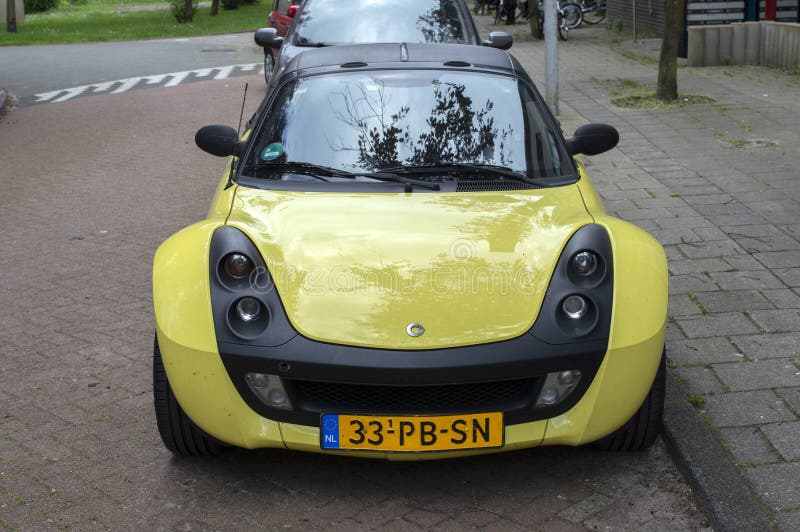 A Yellow Smart Car at Amsterdam the Netherlands 20-5-2024 Editorial ...