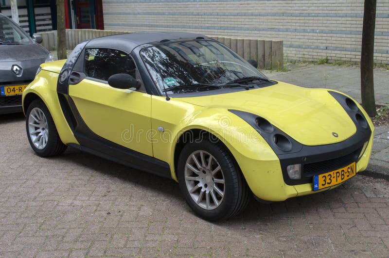 A Yellow Smart Car at Amsterdam the Netherlands 20-5-2024 Editorial ...