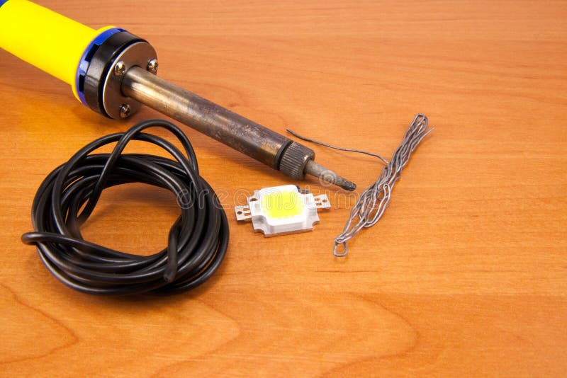 Yellow soldering iron stock photo. Image of instrument - 59398454