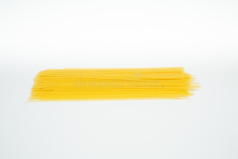 Yellow Spaghetti and Different Types of Bread on a White Background ...