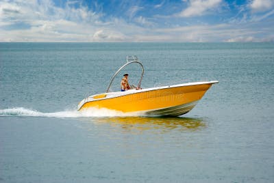 Yellow speed-boat stock photo. Image of splashes, captain - 10281668