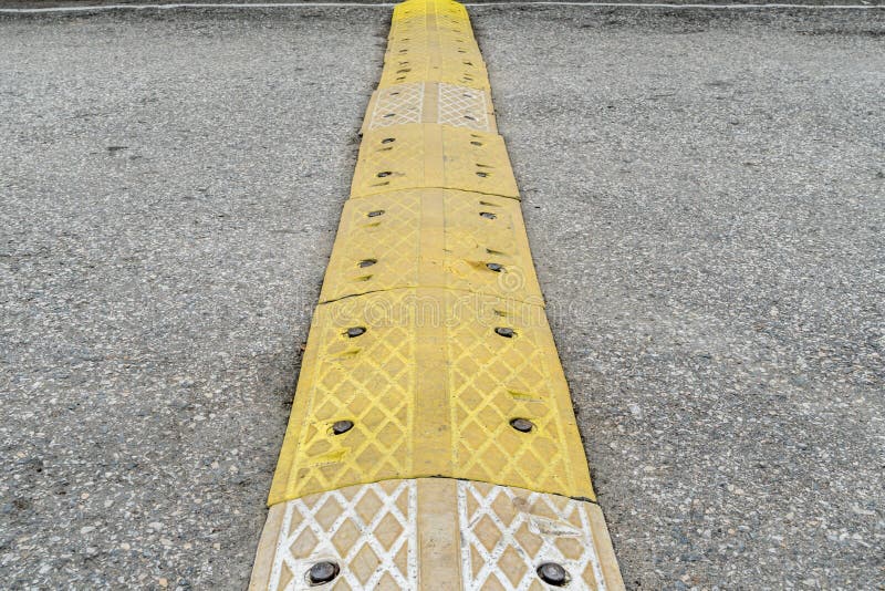 Yellow speed bump stock photo. Image of urban, street - 73982794