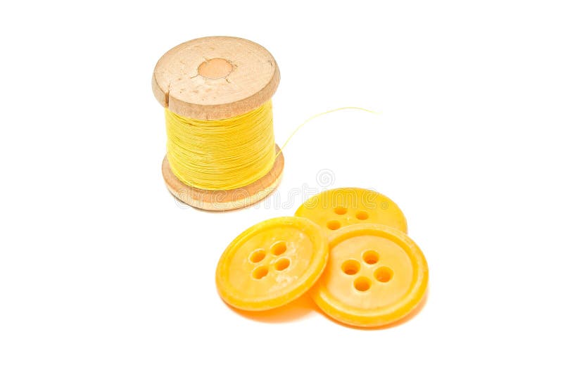 Yellow Spool of Thread and Plastic Buttons Stock Image - Image of ...